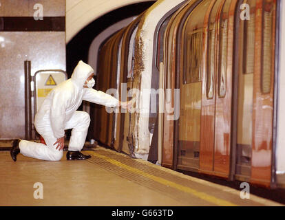 Engineers inspect a damaged train at Chancery Lane underground station ...