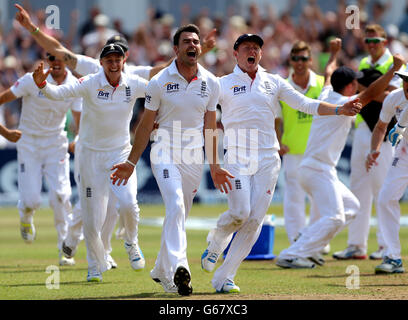 England's Joe Root, left and James Anderson talk before the start of ...