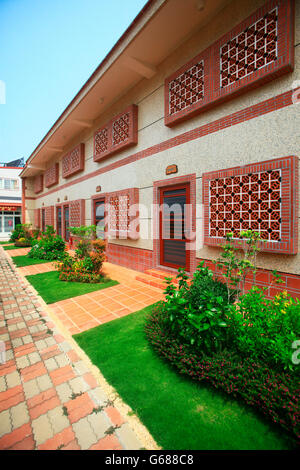 Seaview traditional quadrangle house Stock Photo - Alamy