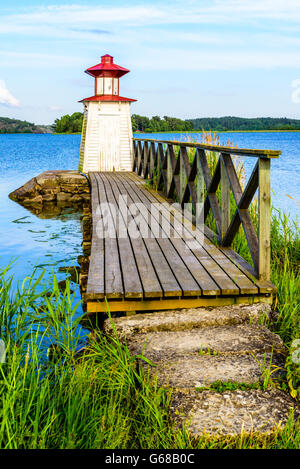A very small lighthouse at the inlet of Gota canal in Mem, Sweden Stock ...