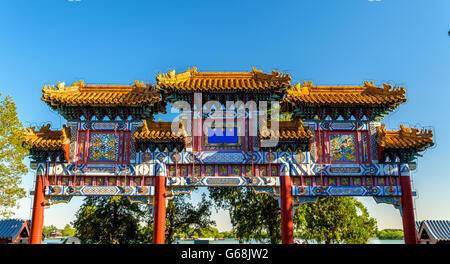 A Chinese paifang gate with blue sky in the background Stock Photo - Alamy