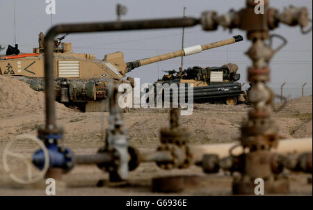 Abandoned Iraqi tanks on the Basra road, Iraq. The road from the Kuwait ...