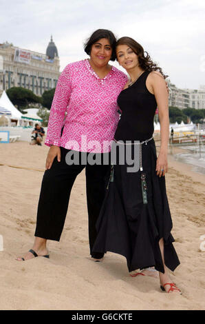 Director and writer Gurinder Chadha, in red, poses for photographers ...