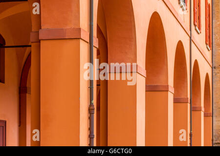colonnade with arches in old red brick building Stock Photo - Alamy