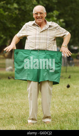 Malcolm Bird, 59, from Suffolk, who now weighs 14st 6lbs, posses in his ...