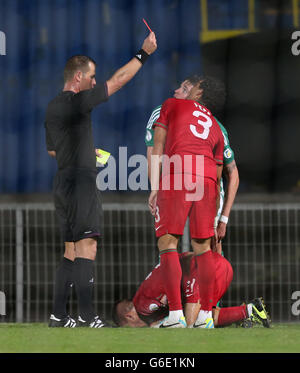 Northern Ireland's Kyle Lafferty is shown a red card by referee Danny ...
