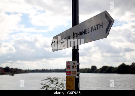 A General picture of a Thames Path sign in showing the towpath along ...