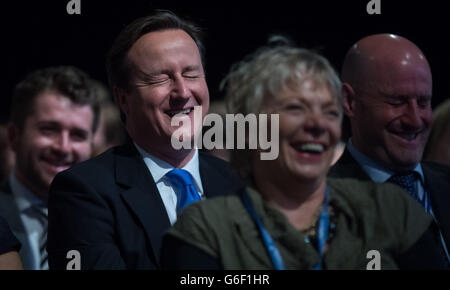 Prime Minister David Cameron laughs as he listens to leader of the ...