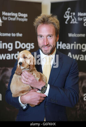 . Ben Fogle poses with hearing dog puppy Aslan at The Hearing Dog ...