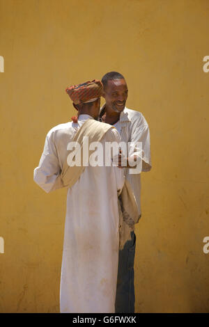 Harari men greeting in the street. Harar, Ethiopia Stock Photo - Alamy