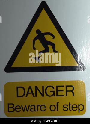 Beware of step sign Stock Photo - Alamy
