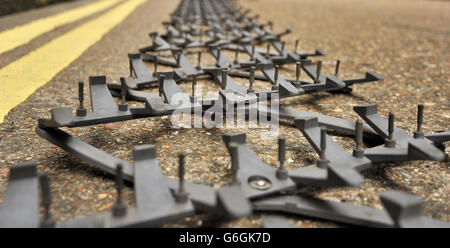 General view of a Police Stinger Spike Strip deployed on a road Stock ...