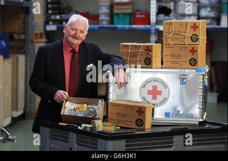 A replica WW2 Red Cross food parcel alongside a modern day equivalent ...
