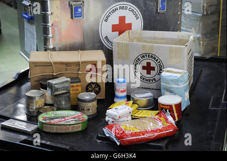 A replica WW2 Red Cross food parcel alongside a modern day equivalent ...