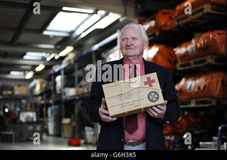 A replica WW2 Red Cross food parcel alongside a modern day equivalent ...