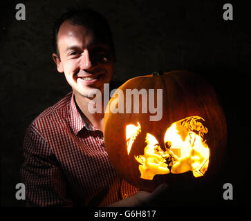 Guinness World Record pumpkin carving champion, Dave Finkle, puts the ...