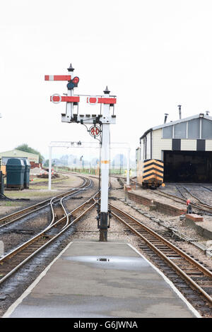 A train at the platform at New Romney station on the Romney, Hythe ...