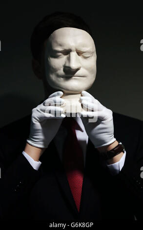 Sir Isaac Newton's death mask held by staff member Emma Smith is part ...