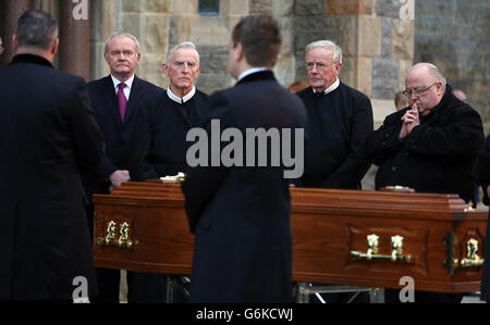 The coffin of Father Alec Reid is carried into Clonard Monastery in ...