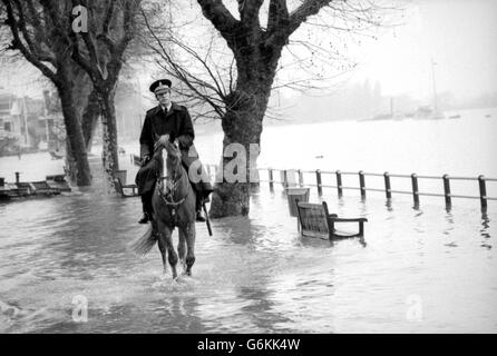 The Thames overflows its banks at Putney. An exceptional tide - over 25 ...