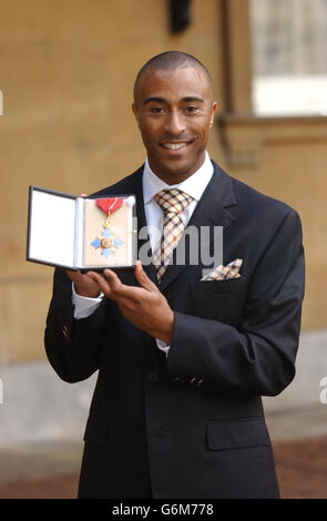 British athlete Colin Jackson holds the CBE he received for services to ...