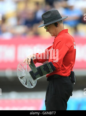 Umpire Bruce Oxenford wears arm protection for the game between England ...