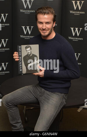 Footballer David Beckham with a copy of his new self titled book, ahead ...