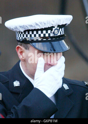 Police officer Pc Neil Roper (second right), attends the funeral of ...