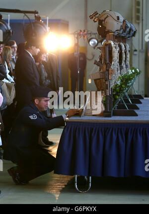 Andy Ponce, the husband of SSGT Afton Ponce, pays his respects in front ...