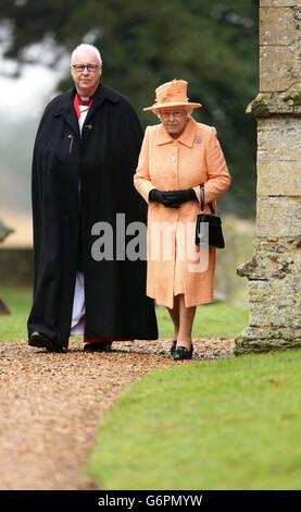 Queen Elizabeth II, alongside the Bishop of Lincoln Christopher Lowson ...