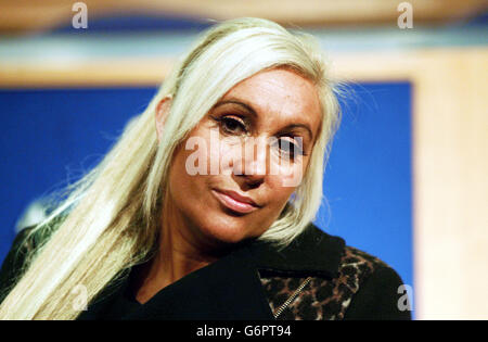 Lisa Cabrera, a victim of domestic violence, talks to media at New ...