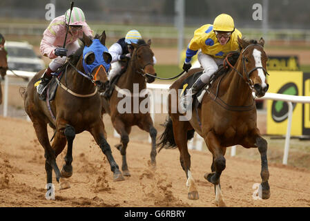 Playtime Blue (right), riden by George Baker, wins the New Site ...