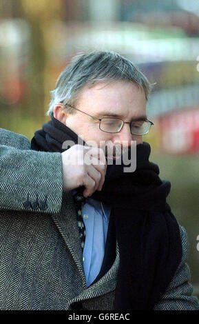 Mr Nelson Bland shields his face as he arrives at Nottingham Crown ...
