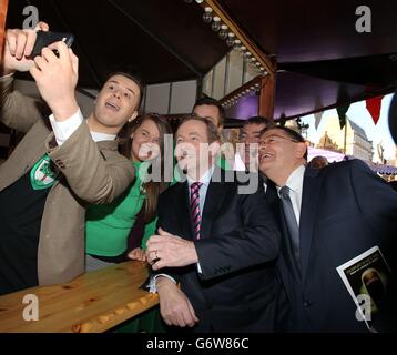 Taoiseach Enda Kenny (centre) has a selfie taken with Fabian Bohan ...