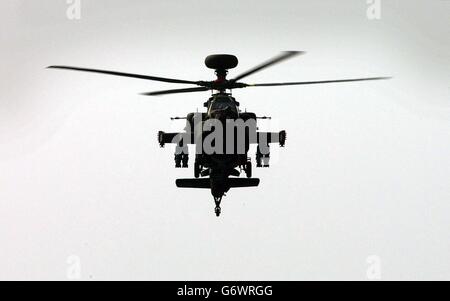 An Apache attack helicopter takes off from HMS Ocean in the Bristol ...