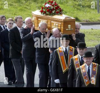 The coffin of Portadown Orange Order leader Harold Gracey makes its way ...