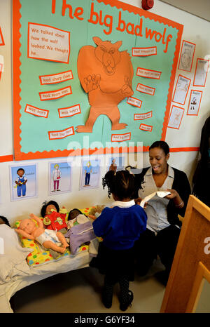 Children and a teacher at the Windrush Nursery in Greenwich, south east ...