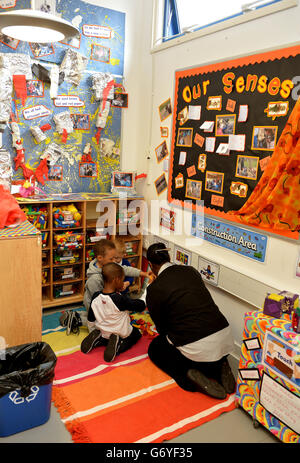 Children and a teacher at the Windrush Nursery in Greenwich, south east ...
