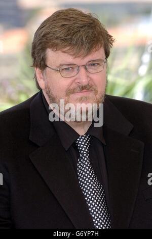 Director Michael Moore poses for photographers on the red carpet before ...