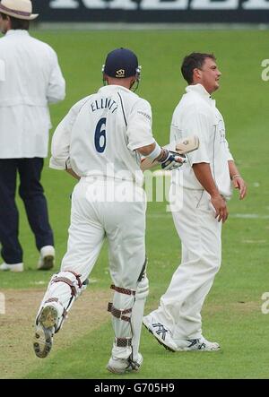 Darren Gough watches the ball go towards the boundary as Bryan Young ...