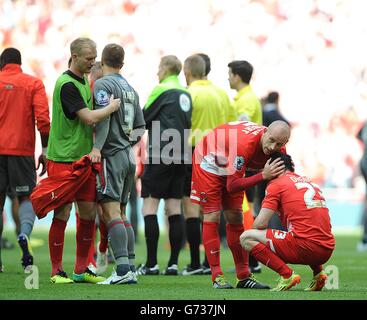 Leyton Orient's Chris Dagnall (right) is consoled by team-mate Dean Cox ...