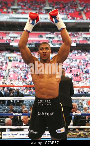 Boxing - Undercard - Wembley Arena. Anthony Joshua (right) celebrates ...