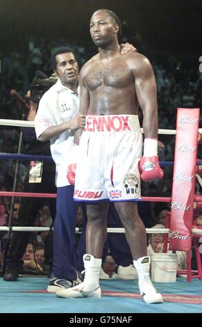 Heavyweight champion Mike Tyson, right, throws a right at the face of ...