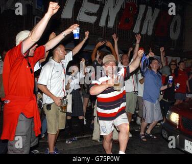 Japan fans celebrate after the World Cup Group F soccer match against ...