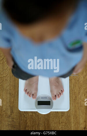 Child being weighed Stock Photo - Alamy