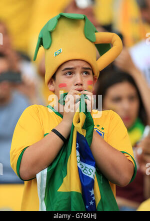 A fan reacts before the World Cup Group K soccer match between Colombia ...