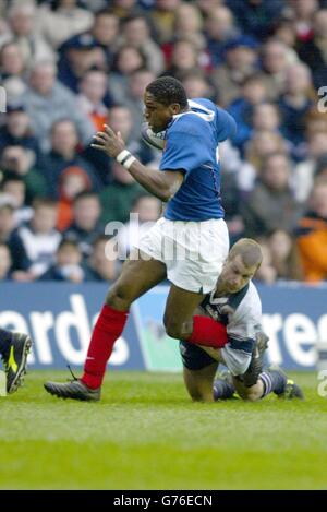 France's Jimmy Marlu is tackled by Scotland's Chris Paterson during ...