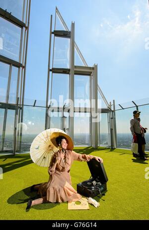 Maureen Schipper sits on the new artificial lawn at the View From the ...