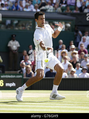 Serbia's Novak Djokovic plays a shot back between his legs during an ...