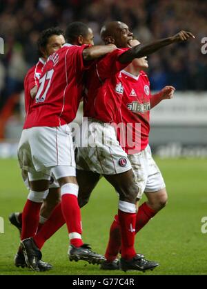 Charlton Athletic's Richard Rufus (left) and Carl Tiler (back) clash ...